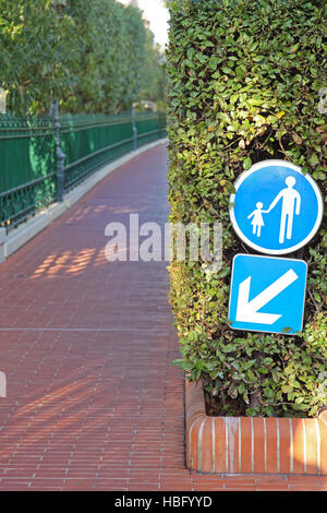 Pedestrian pathway sign on brick road pavement Stock Photo - Alamy