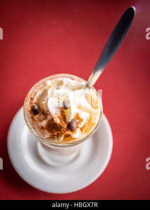 Latte macchiato with whipped cream, serving silver spoon Stock Photo ...