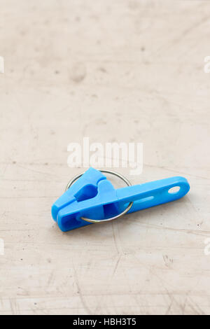 Blue broken plastic clothespin Stock Photo - Alamy