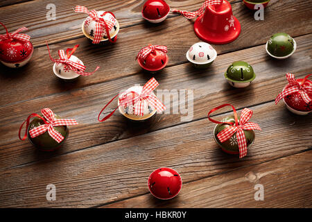Christmas Jingle bells on a rustic wooden background Stock Photo - Alamy