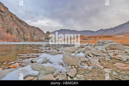 Mountain village winter brook Stock Photo - Alamy
