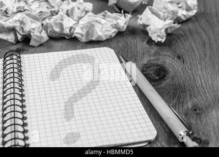Question mark on notebook page Stock Photo - Alamy