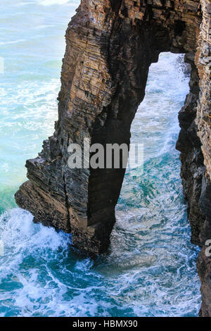 Natural rock arches on Cathedrals beach in Galicia, Northern Spain ...