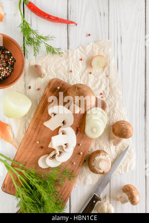 Green onions and mushrooms on a wooden board Stock Photo - Alamy