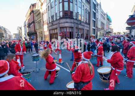 Katumba drummers encourage runners 2016 Santa Dash in Liverpool which broke the world record for ...