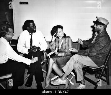 FATHER GOOSE, director Ralph Nelson going over script with Pip Sparke ...