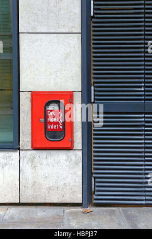 Dry riser red inlet box and sign at wall Stock Photo - Alamy