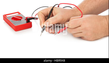 Hands and electric multimeter Stock Photo - Alamy
