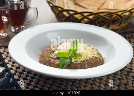oqda , fried potatoes with meat popular arab food Stock Photo - Alamy