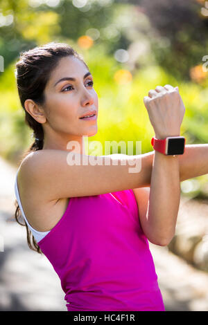 Woman exercising in a park Stock Photo - Alamy