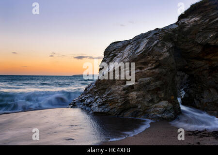 Water coming through a natural alcove at Spit Beach, St Austell ...