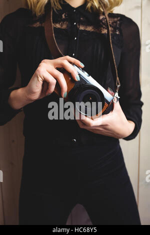 Mid section of young woman standing Stock Photo - Alamy