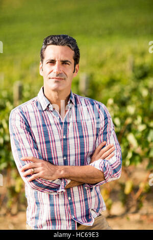 Portrait of man with arms crossed at vineyard Stock Photo - Alamy