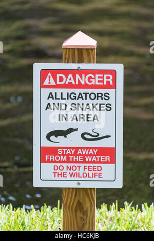 Florida alligator warning sign swim with cautiion Stock Photo - Alamy