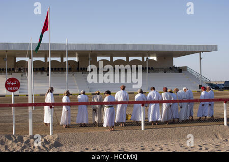 Musicians playing and singing traditional Omani music with instruments ...