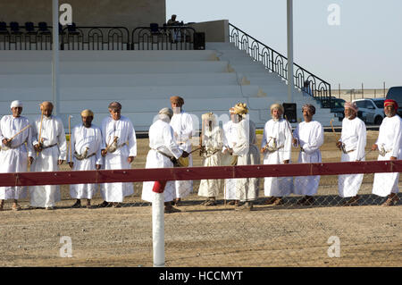 Musicians playing and singing traditional Omani music with instruments ...