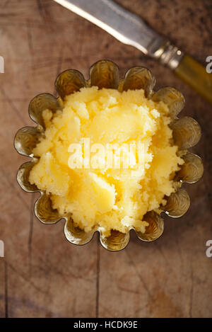 ghee or melted butter in mold on wooden table Stock Photo - Alamy