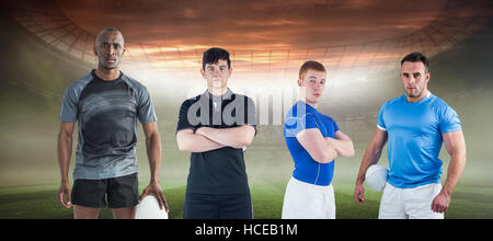 Composite image of tough rugby players Stock Photo - Alamy