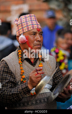 Nepalese devotees playing traditional instruments during Bishnudevi ...