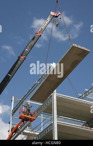 Construction site, PCC precast plank floor deck, structural steel frame ...