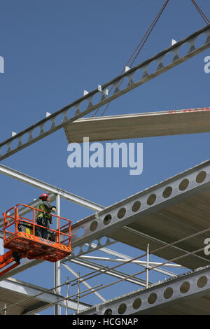 Construction site, PCC precast plank floor deck, structural steel frame ...