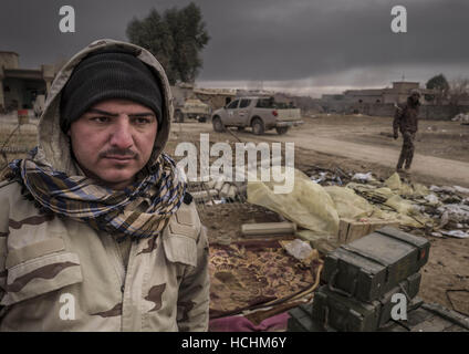 Al Qayyarah, Iraq. 8th Dec, 2016. Iraqi army soldier is at their base ...