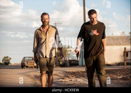 THE ROVER, from left: Guy Pearce, Robert Pattinson, 2014. ph: Matt ...