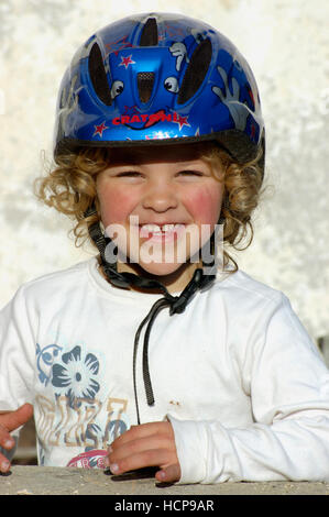 Children wearing crash helmet, smiling Stock Photo - Alamy