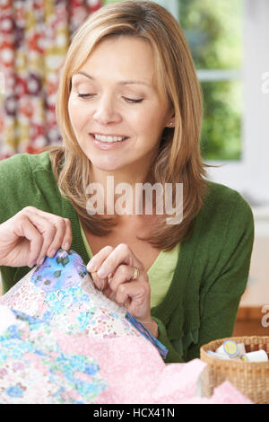 Portrait Of Woman Sewing Quilt Stock Photo - Alamy