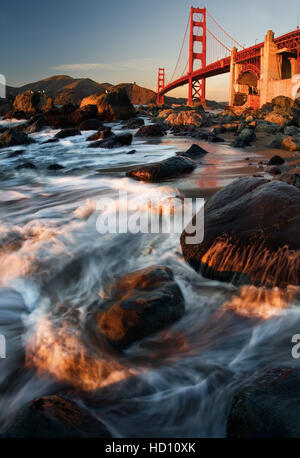 A beautiful foggy view of the Golden Gate Bridge in San Francisco with ...