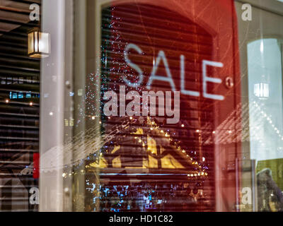 a shop window showing sale sign Stock Photo - Alamy