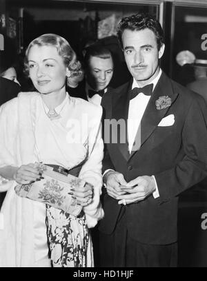 Constance Bennett and husband Gilbert Roland attending movie premier ...