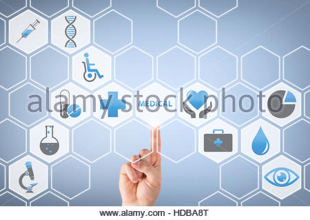 Medical doctor touching icons of health care services on a digital ...