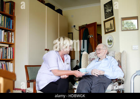 Care worker Yvonne with JRHT resident John Cockerton Stock Photo - Alamy