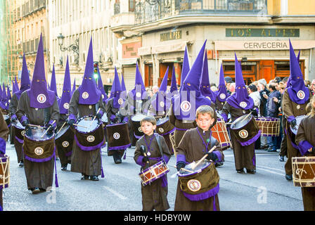 Members of a catholic brotherhood march during a procession in Madrid ...