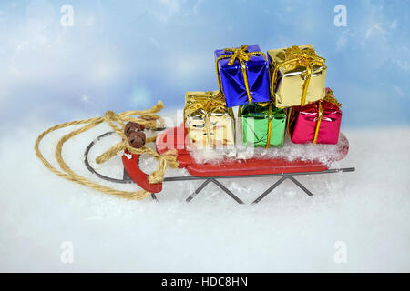 Sled in the snow with Christmas gifts on a white background Stock Photo ...