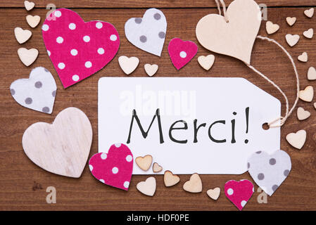 Merci (which means thank you in French) written with wooden letters on ...
