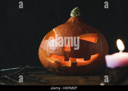 Funny Halloween pumpkin on dark background Stock Photo - Alamy