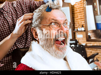 Santa claus shaving his personal barber Stock Photo - Alamy