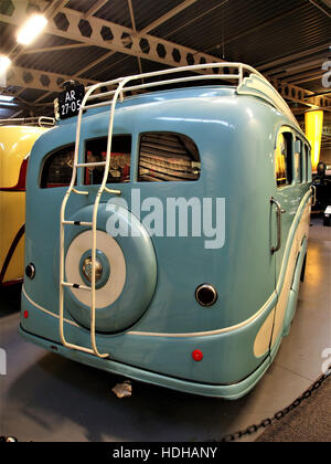 The 1937 Ford 950 Personenbus, a classic luxury bus, is captured in ...