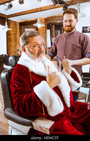 Santa claus shaving his personal barber Stock Photo - Alamy