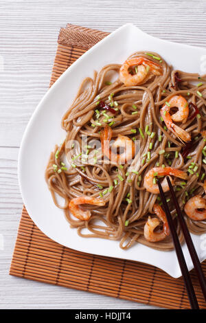Buckwheat in a white plate. Up view. Wooden background Stock Photo - Alamy