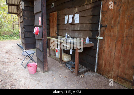 rustic wooden campsite toilet block with outside sink Stock Photo - Alamy