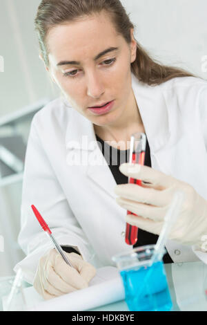 scientist observing results of chemistry experiment Stock Photo - Alamy