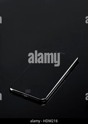 Apple iPhone 7 Plus with blank screen isolated on shiny black ...