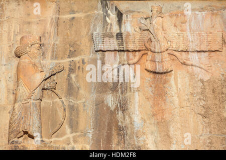 Faravahar - relief of winged sun symbol of Zoroastrianism in ruined ...