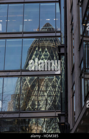 distorted reflections of the evening cityscape in new glazed buildings ...