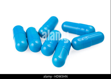 Blue pills isolated on white Stock Photo - Alamy