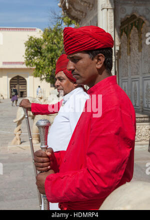 Palace Guards, dressed in traditional uniforms stand guard in the Diwan ...