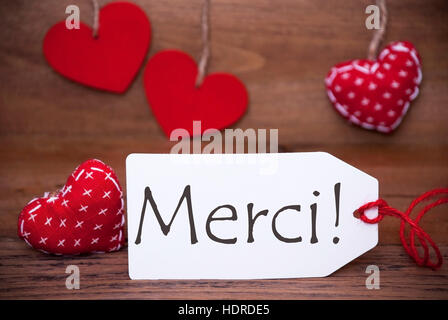 Merci (which means thank you in French) written with wooden letters on ...